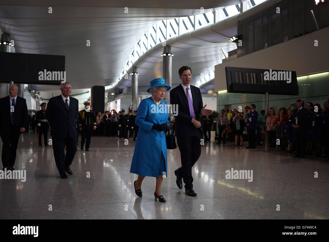 Queen Elizabeth II is shown around the new Terminal 2 The Queen's ...