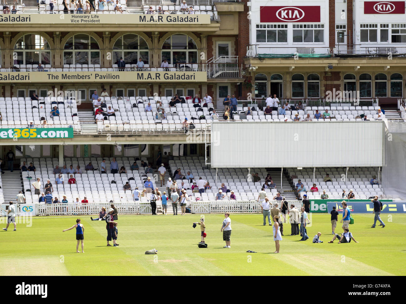 People play cricket on the outfield during lunch hi-res stock ...