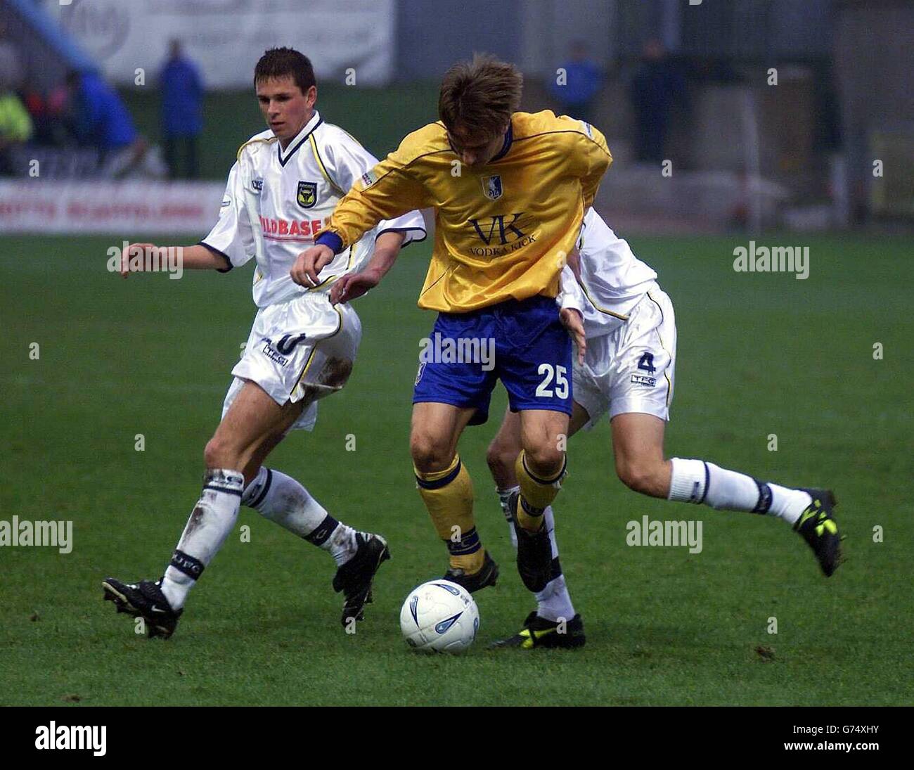 Mansfield's Lee Lawrence takes the ball away from the Oxford's Dave ...