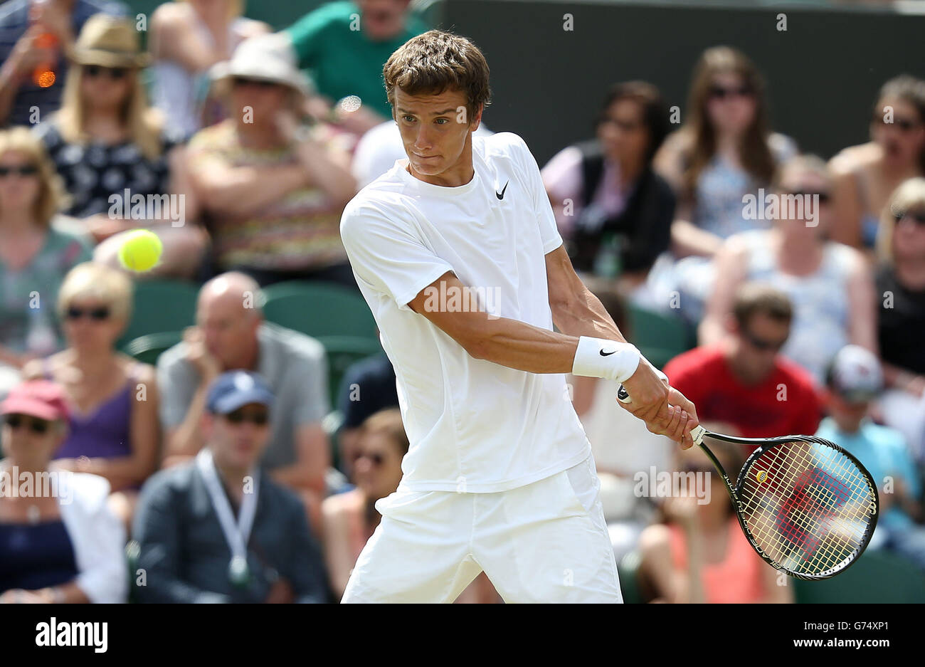 Russia's Andrey Kuznetsov in action against Spain's David Ferrer during ...