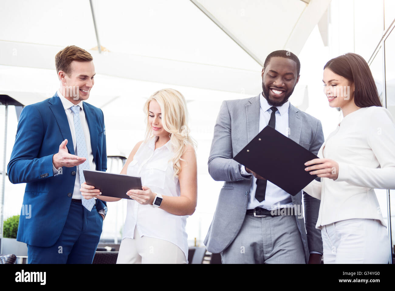 Positive colleagues working in the office Stock Photo - Alamy