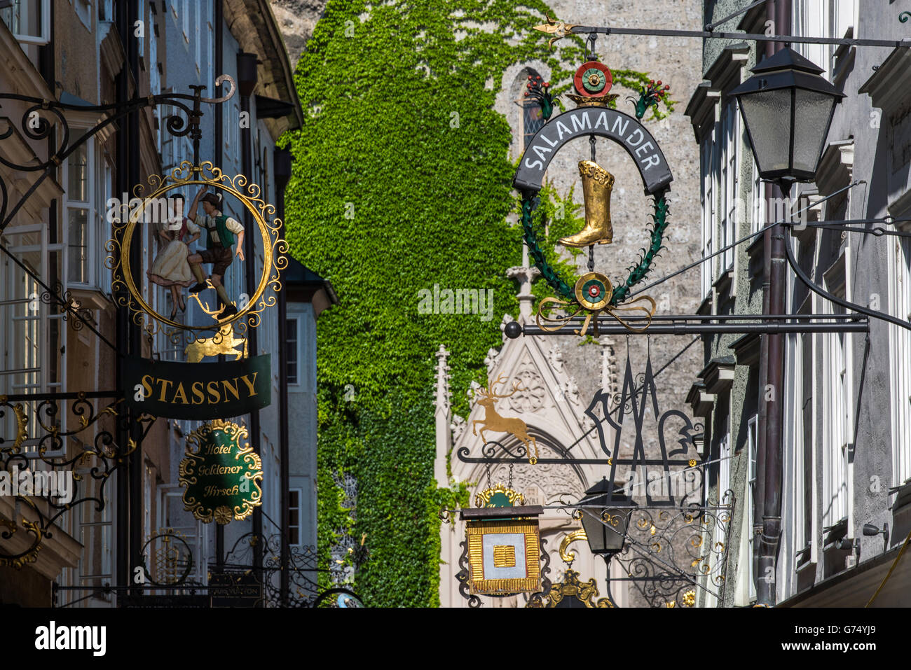 Typical wrought iron guild signs in Getreidegasse, Salzburg, Austria ...