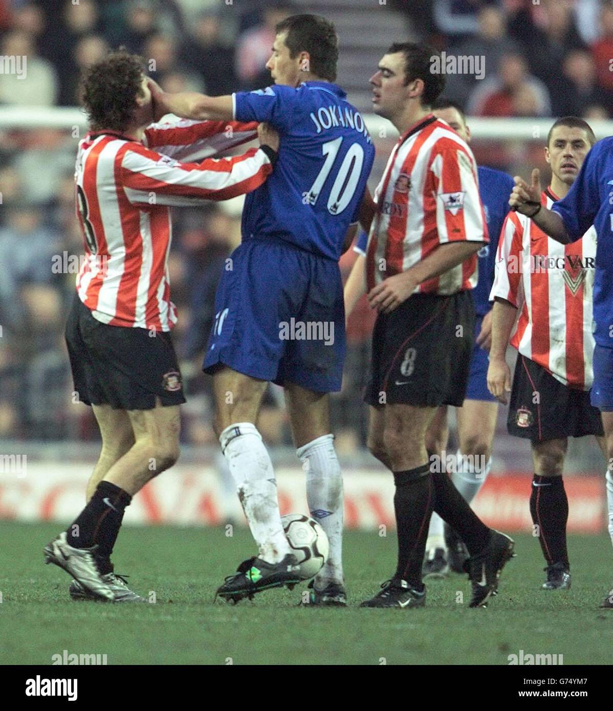 Chelsea's Slavic Jokanovic (centre) gives Sunderland's Julio Arca a ...