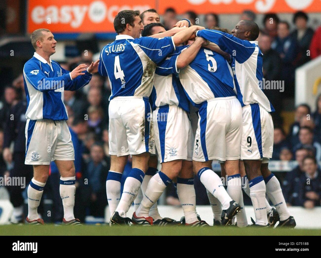 Everton's David Weir (number 5) is smothered by teammates after ...