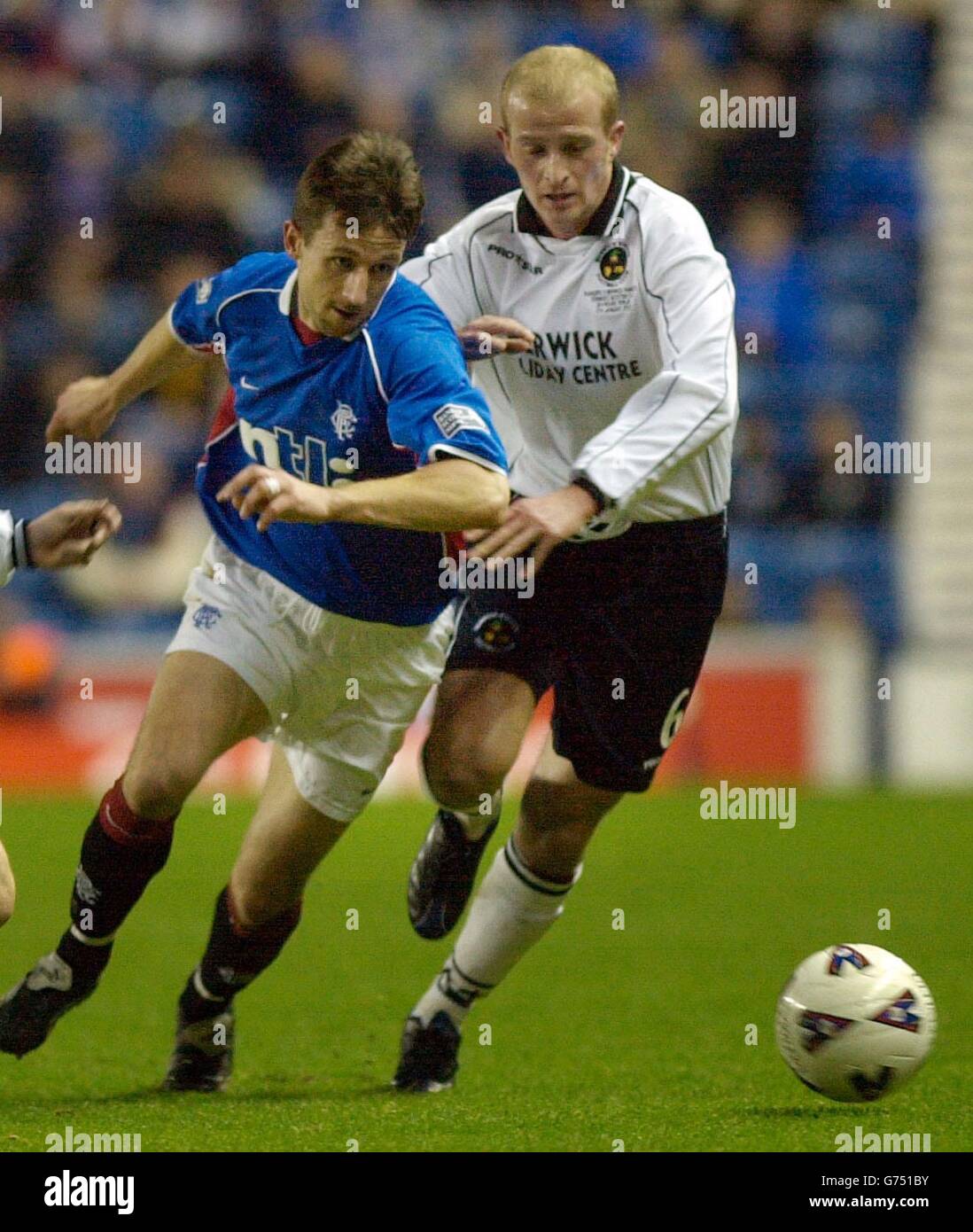 Glasgow Rangers' Neil McCann (right) and Berwick's Gordon Forrest fight ...