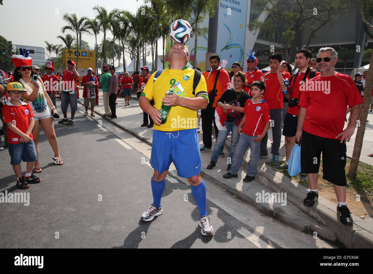 A ball juggler outside the Maracana entertains the fans before the Spin ...