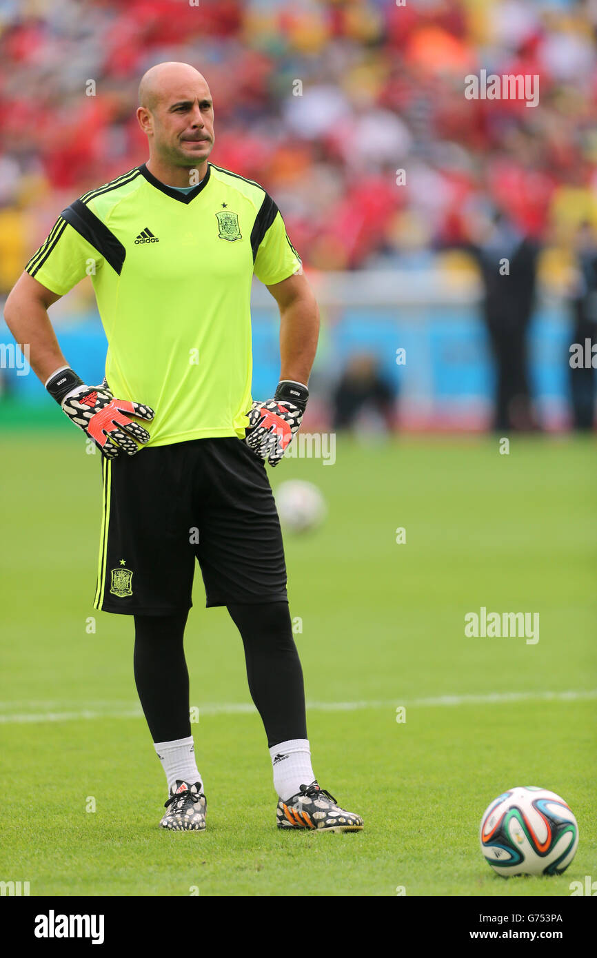 Spain goalkeeper Jose Reina (left) warms up before their game against ...