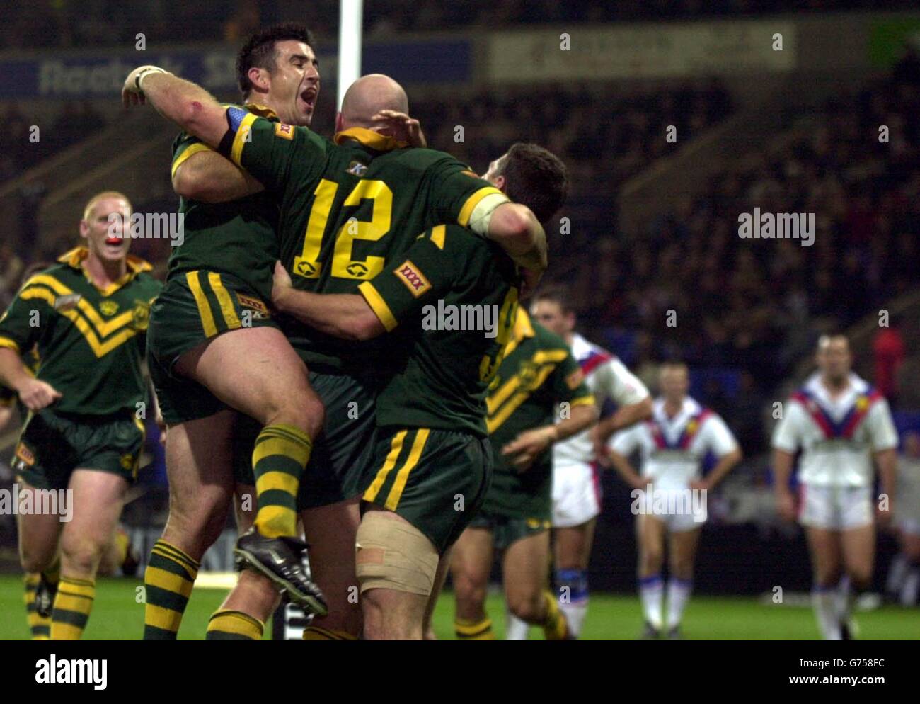 Australian Ben Kennedy (no.12) celebrates with team-mates after scoring ...