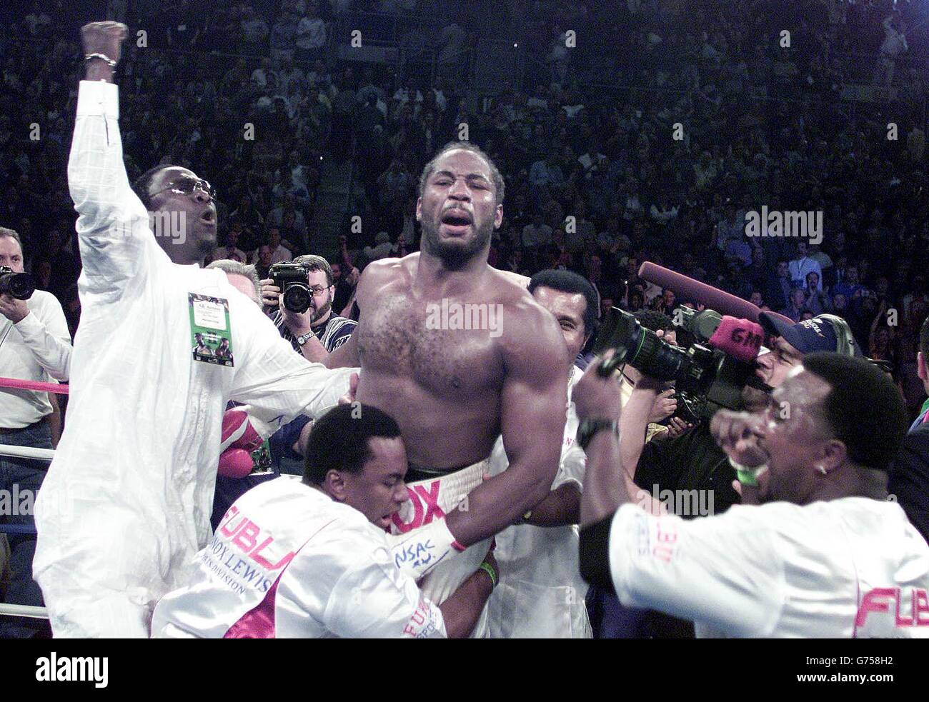 Great Britain's Lennox Lewis celebrates after knocking out USA's Hasim ...
