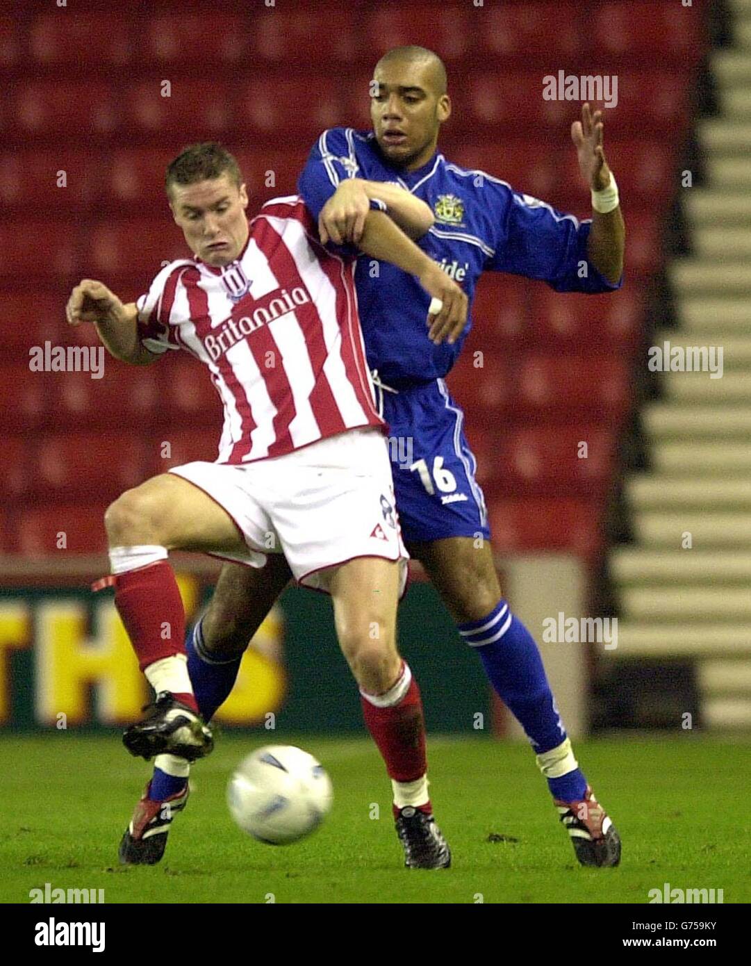 Stoke's Andy Cooke (left) and Halifax's Matt Clarke during the FA Cup ...