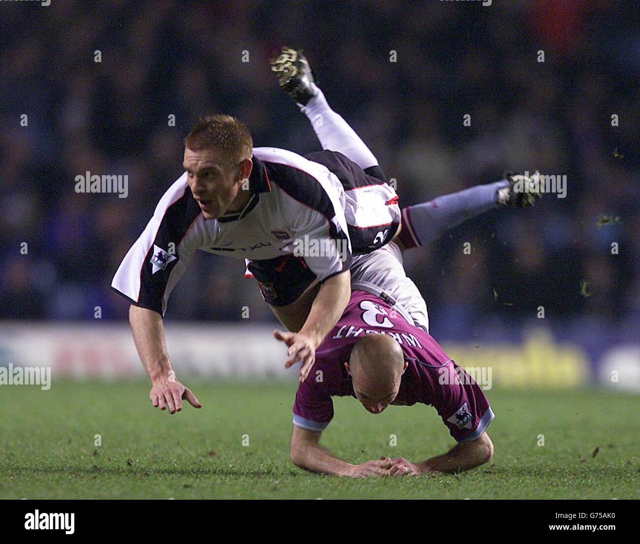 Football action colliding falling hi-res stock photography and images ...