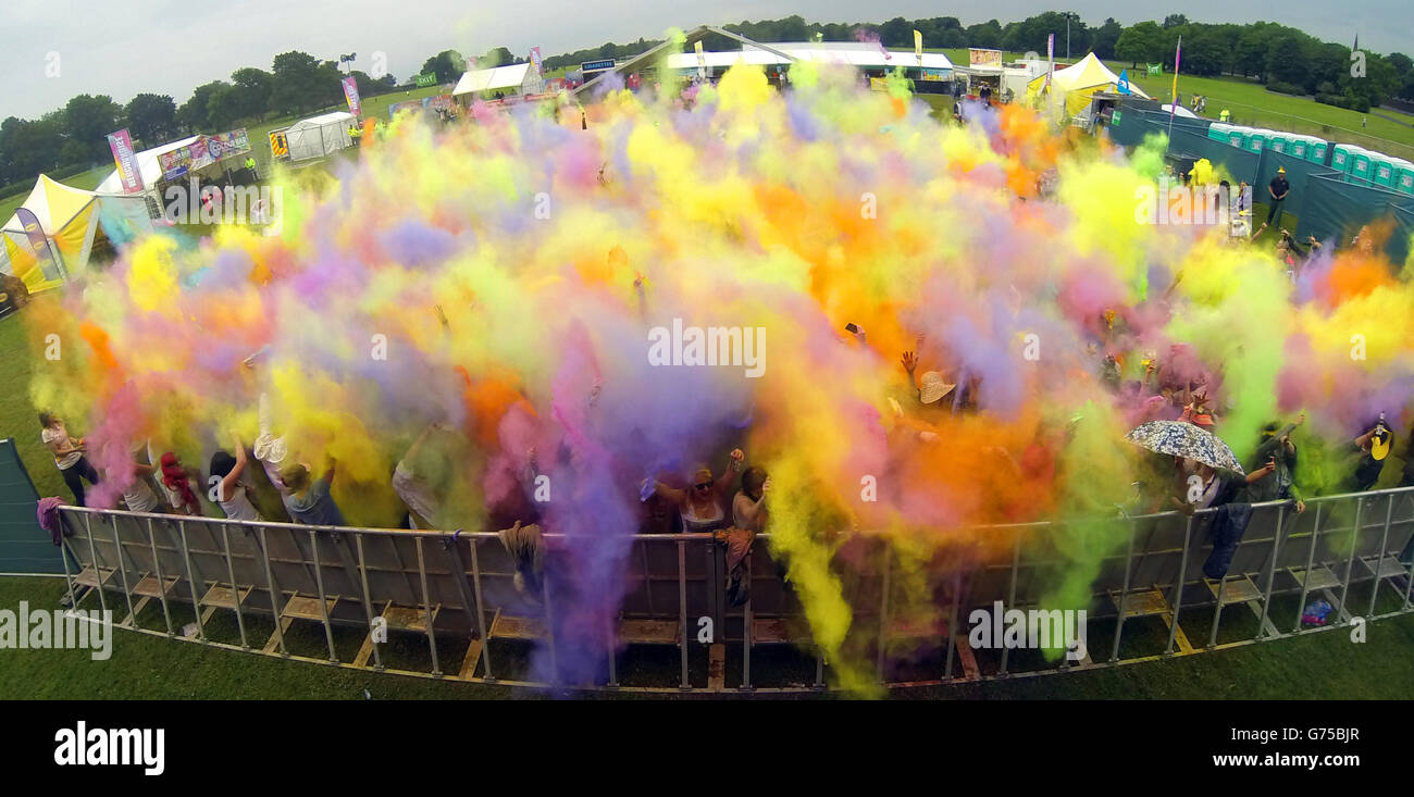 People throw paint - rice flour coloured with water soluble food ...