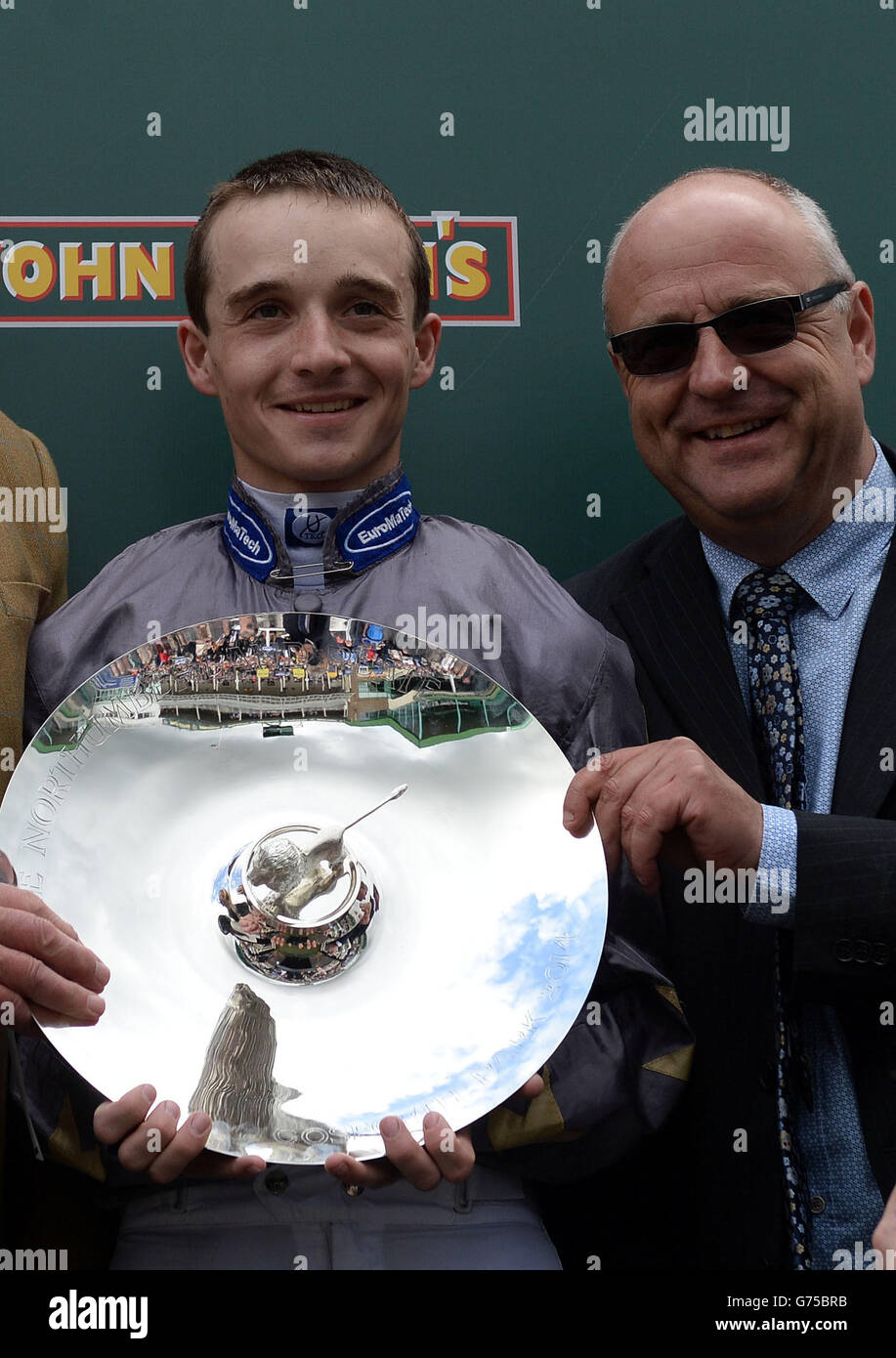 Jockey George Chaloner and trainer Richard Fahey after their victory ...