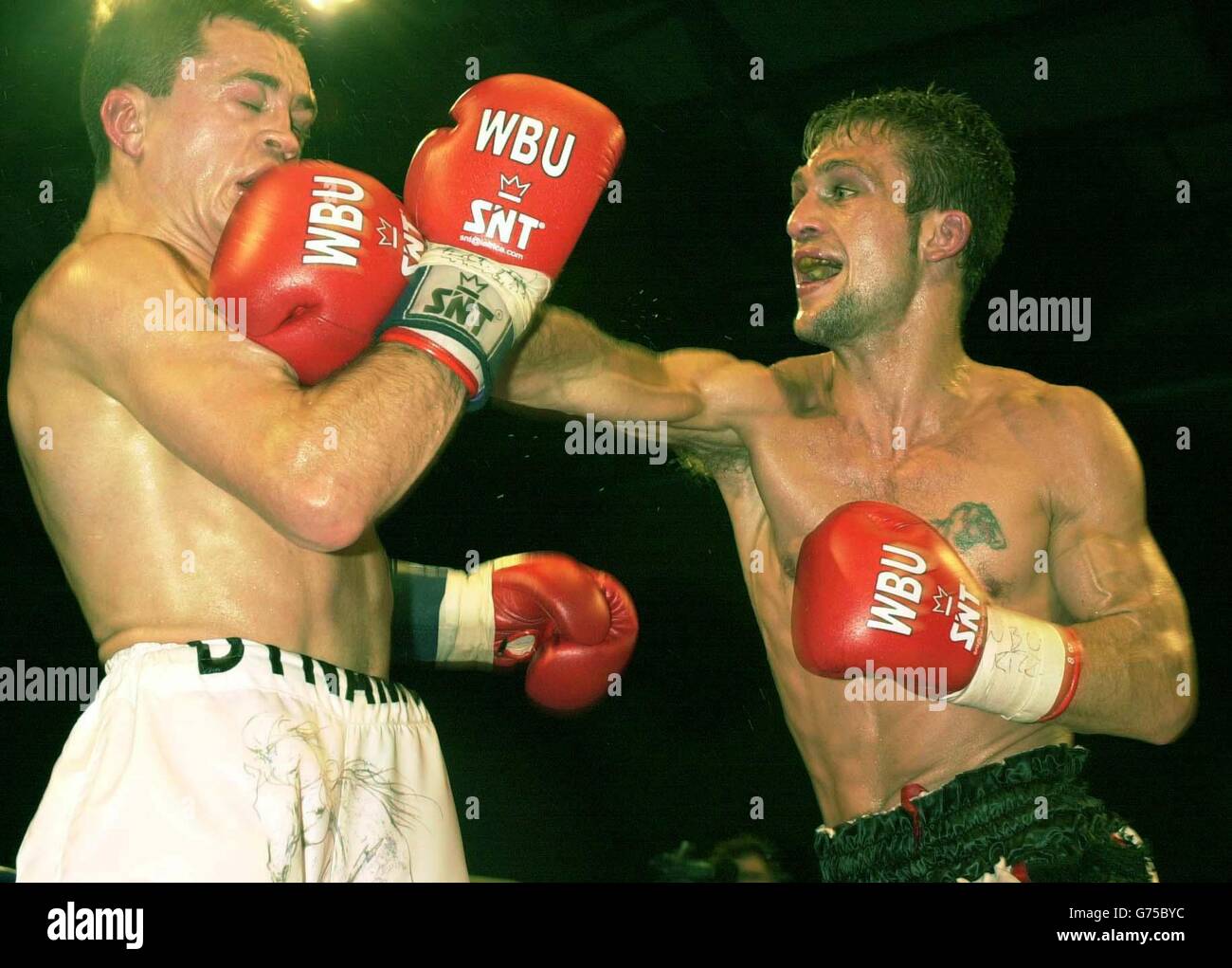 WBU World Lightweight champion Colin Dunne, (left), on his way to a ...