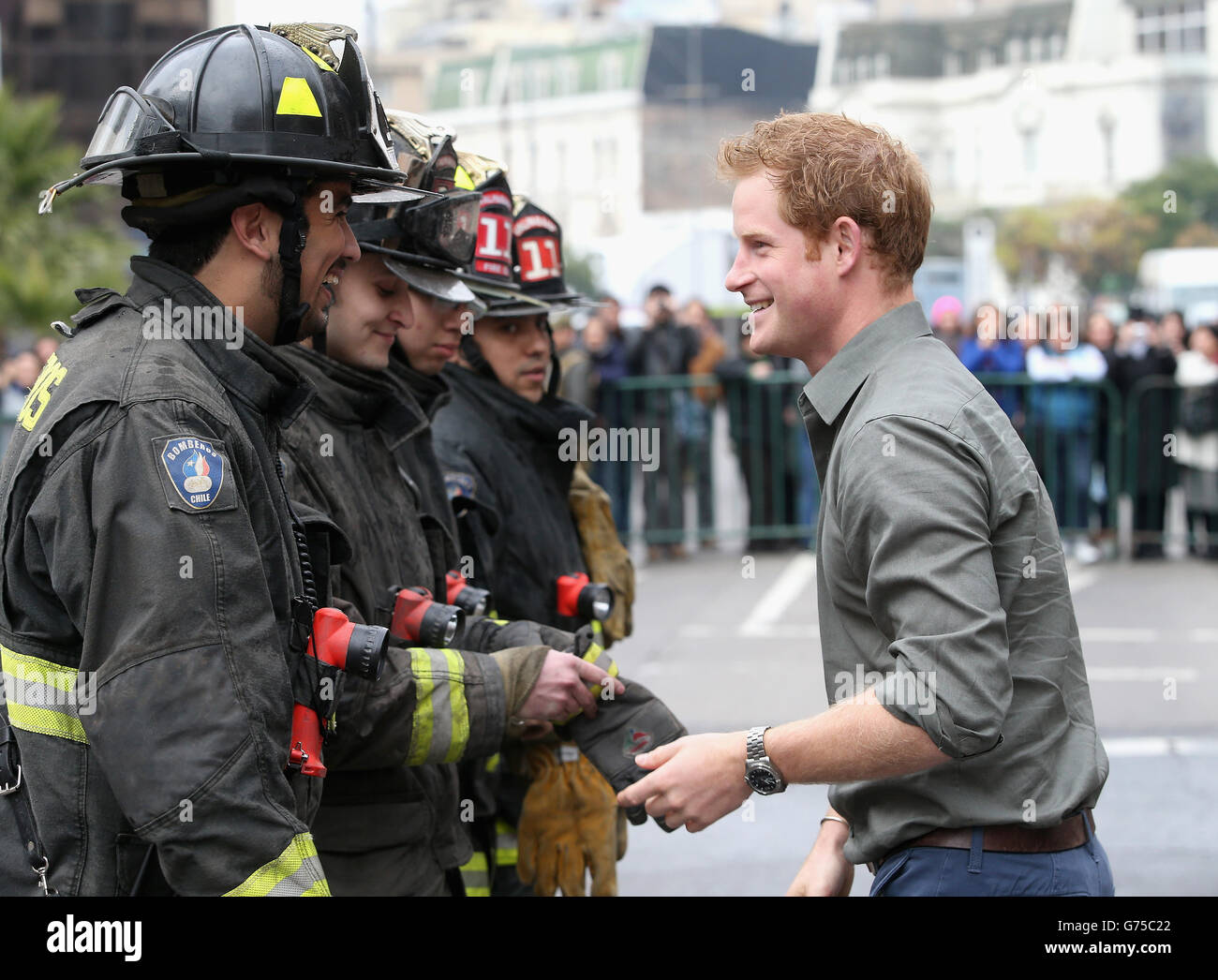 Prince Harry meets firefighters who were involved in dealing with the ...