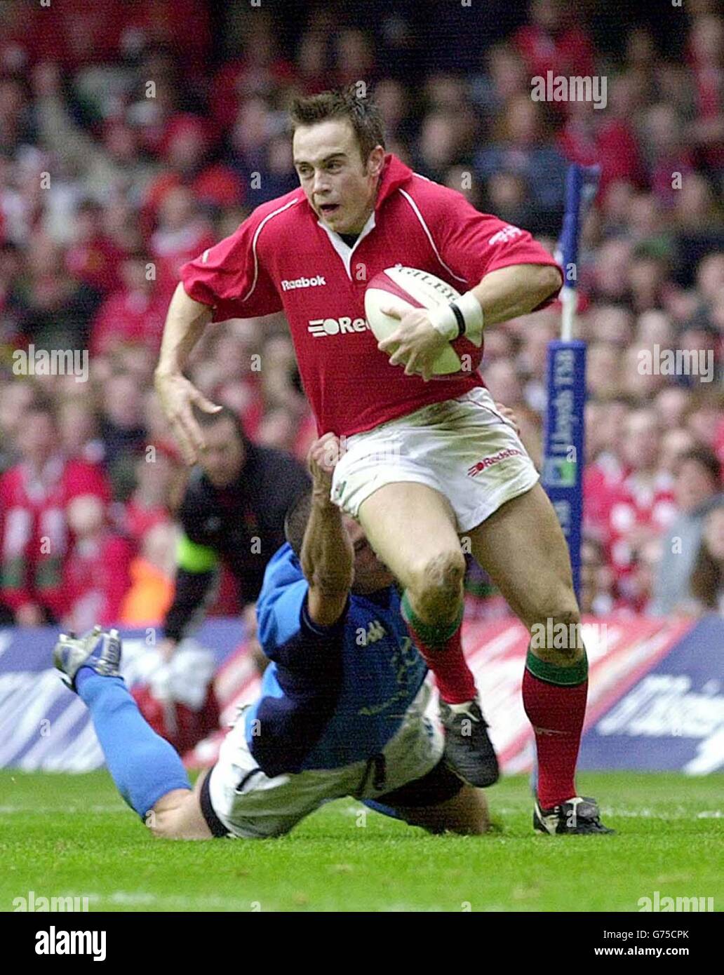 Wales's Rhys Williams breaks the Italian defence during their Lloyds ...