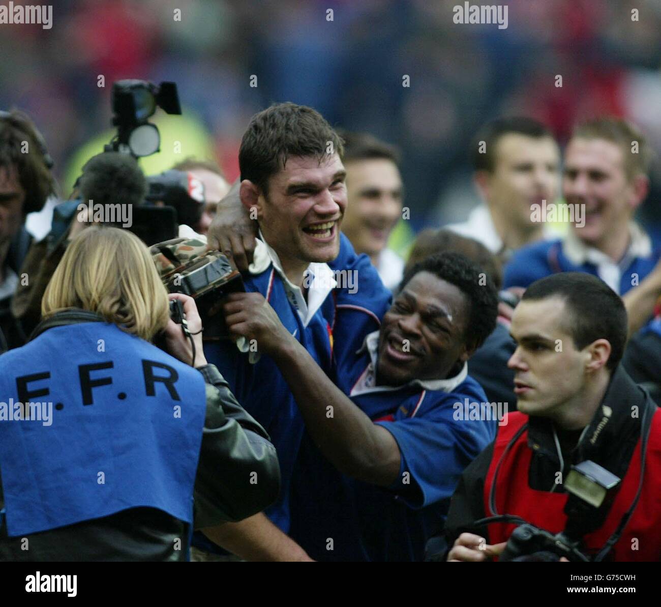 France's Serge Betsen (right) and Fabien Pelous celebrate the 20-15 win ...