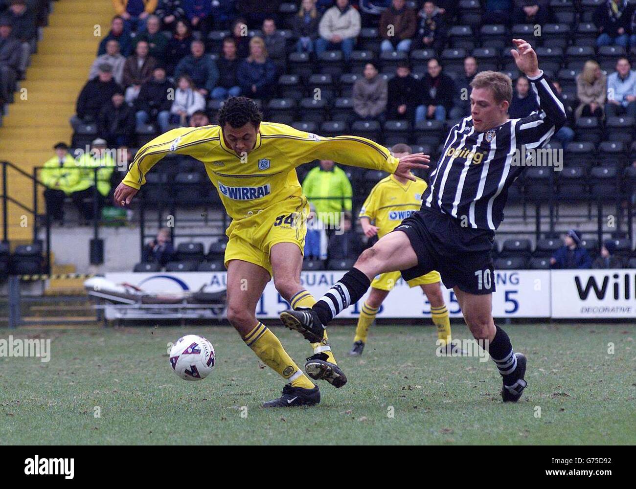 Tranmere Rovers' Jason Price (left) is tackled by Notts County's Danny ...