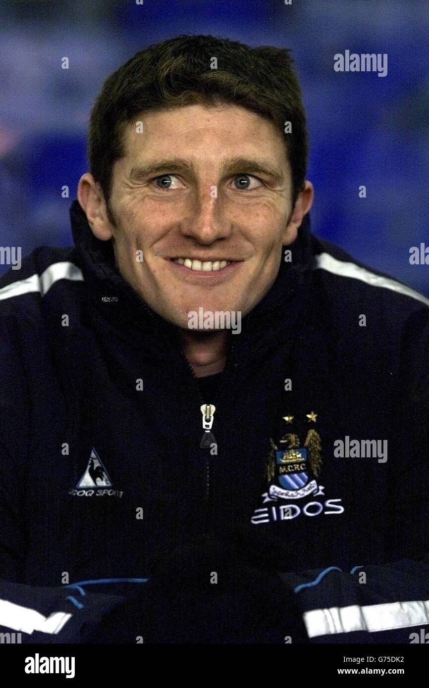 Manchester City's new signing Jon Macken on the bench before their ...