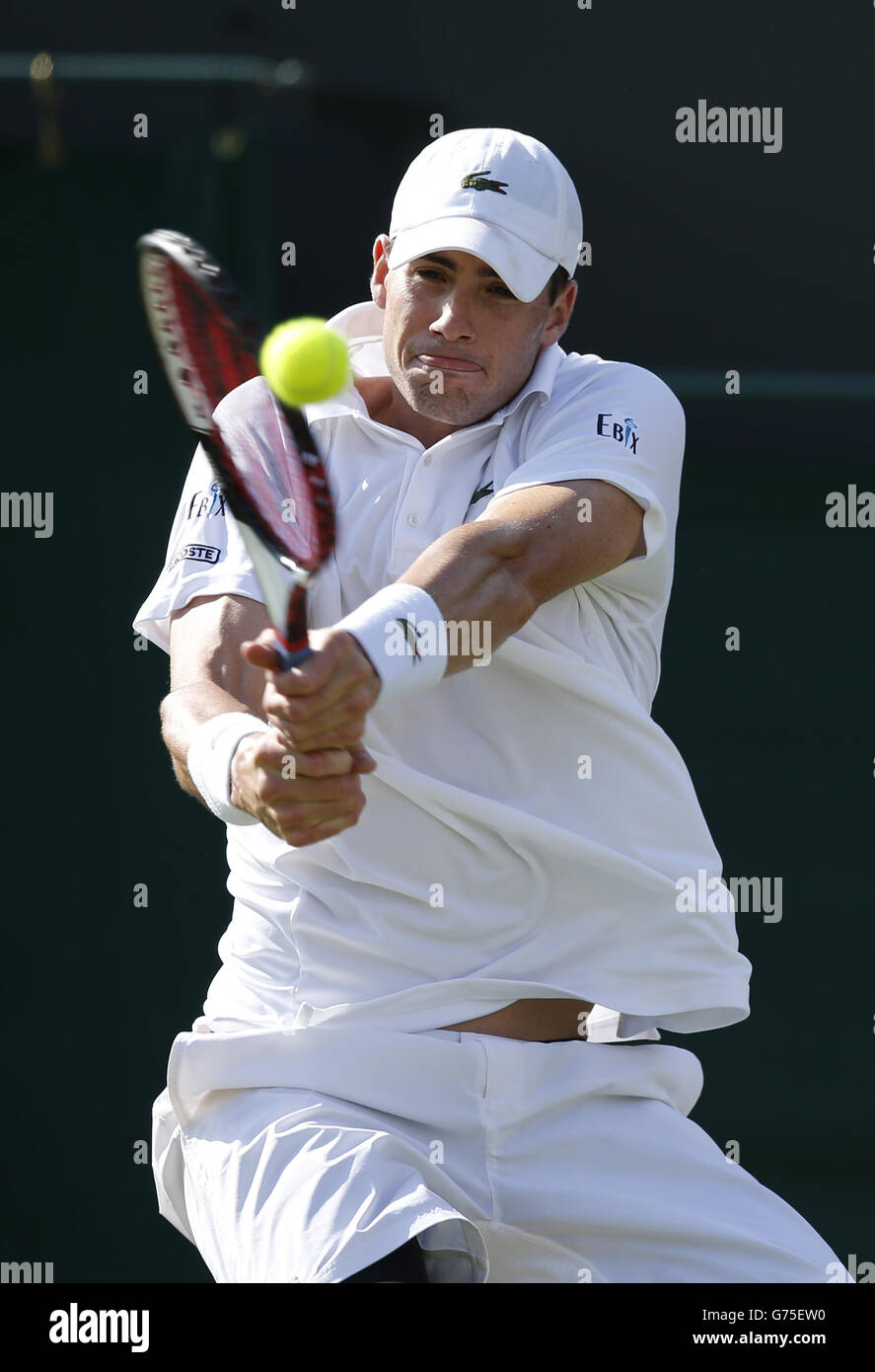 USA's John Isner in action against Great Britain's Daniel Smethurst ...