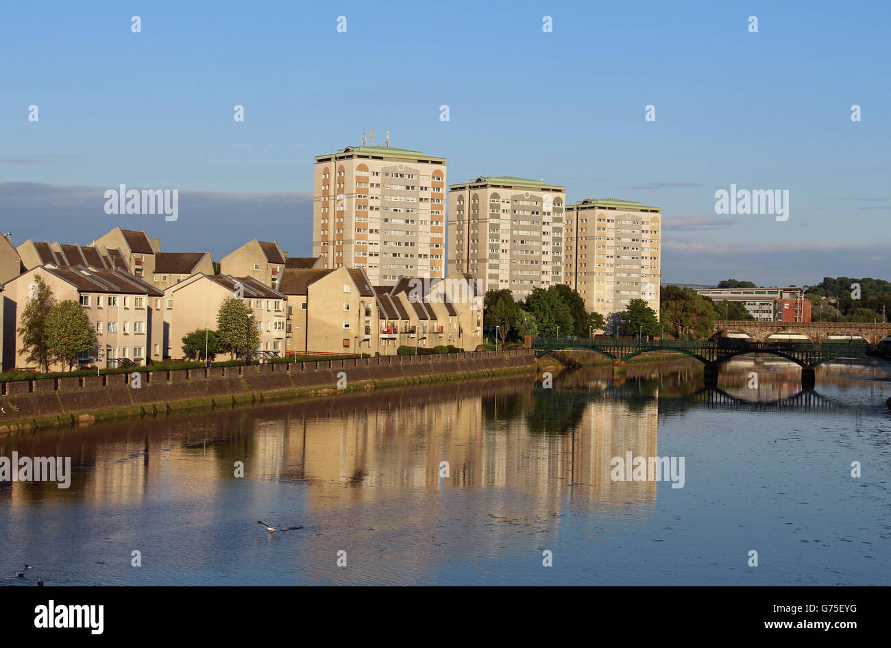 Modern riverside buildings with reflections in the River Ayr at Ayr ...