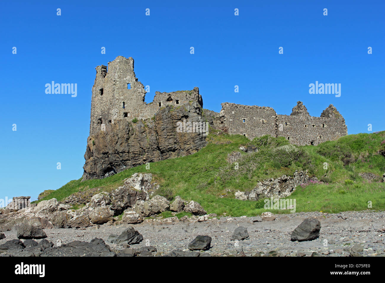 The ruins of Dunure castle on a rocky promontory on the Carrick ...