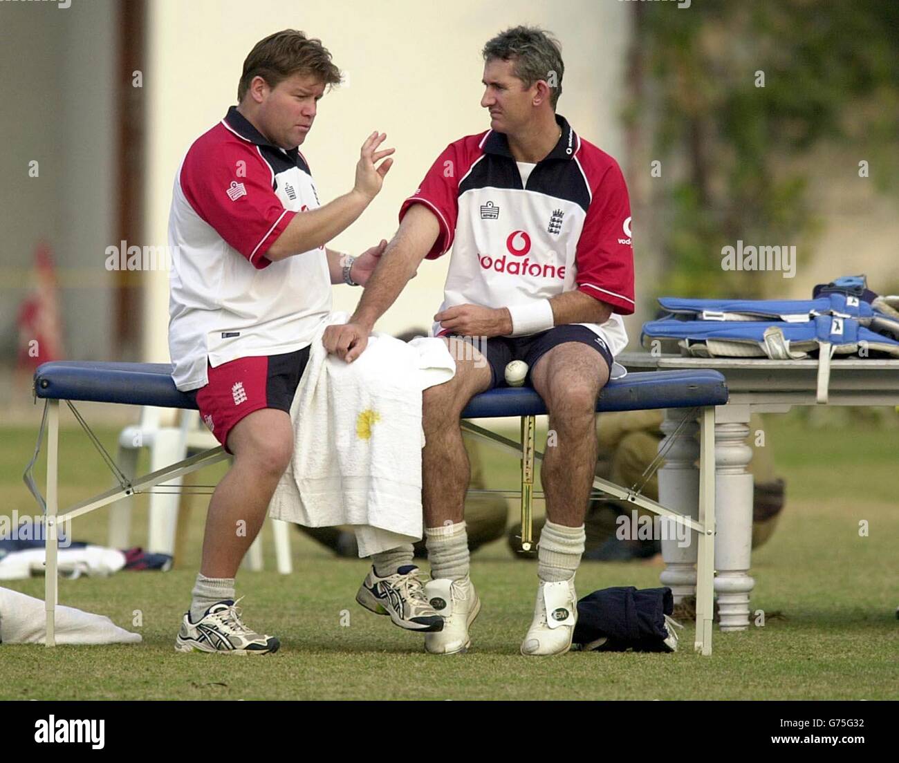 England physiotherapist Dean Conway (left) with bowler Andrew Caddick ...
