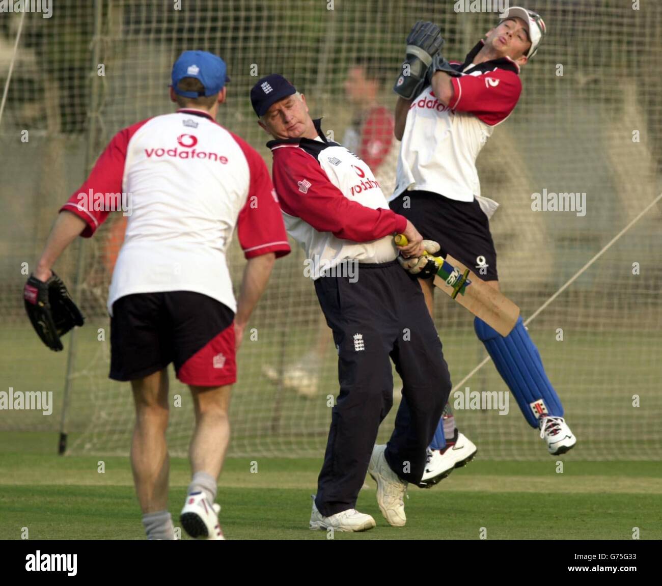 England wicketkeeper James Foster leaps to catch the ball, with England ...
