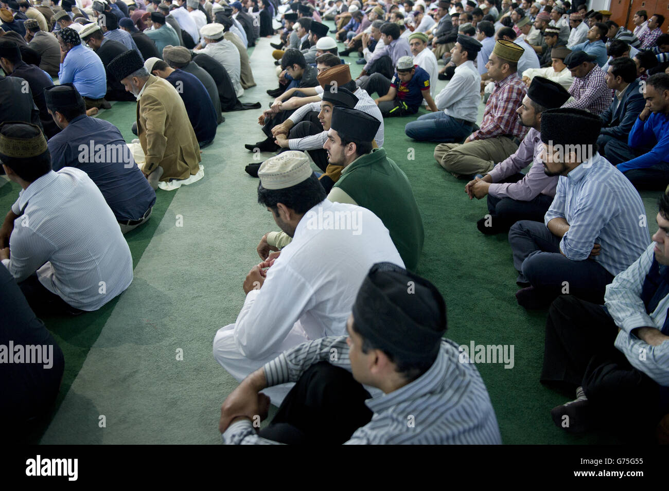 Ahmadiyya Muslims attend Friday prayers to hear His Holiness Mirza ...