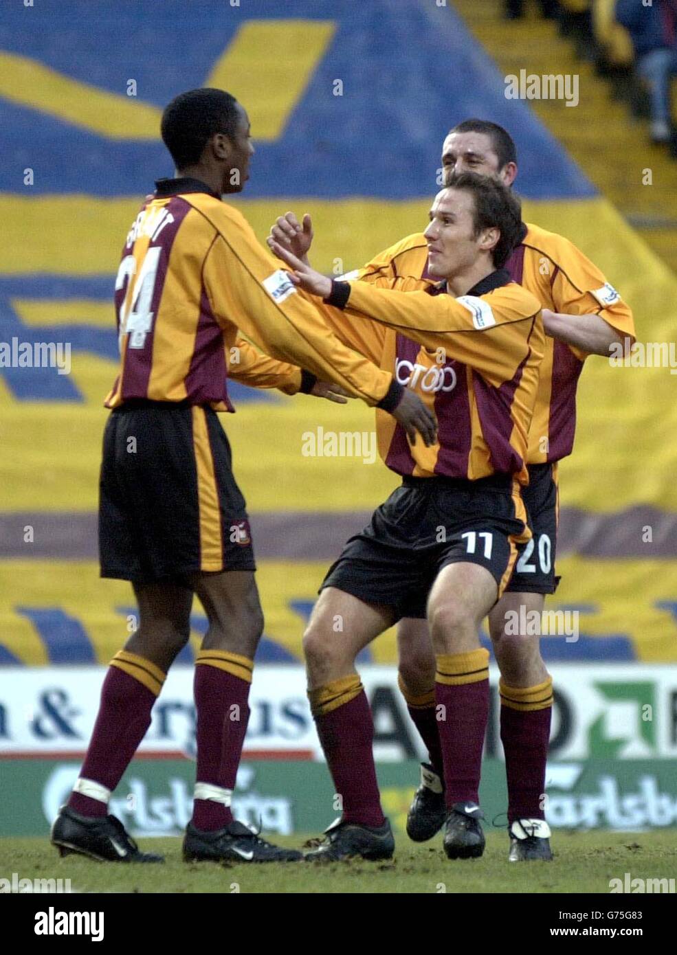 Bradford's Gareth Grant (left) celebrates after equalising against ...