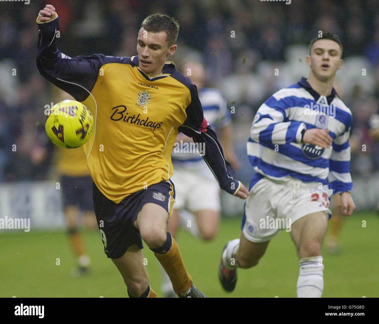 Bury's Jon Newby (left) tussles with Danny Murphy of Queen's Park ...