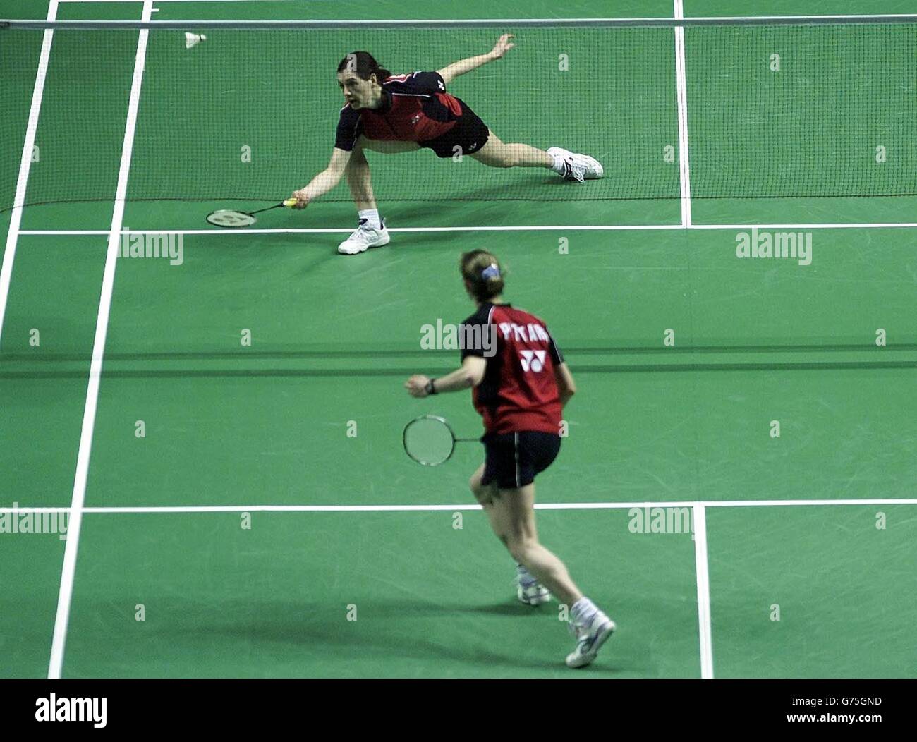 Kelly Morgan of Wales (top) reaches for a return against Jill Pittard ...