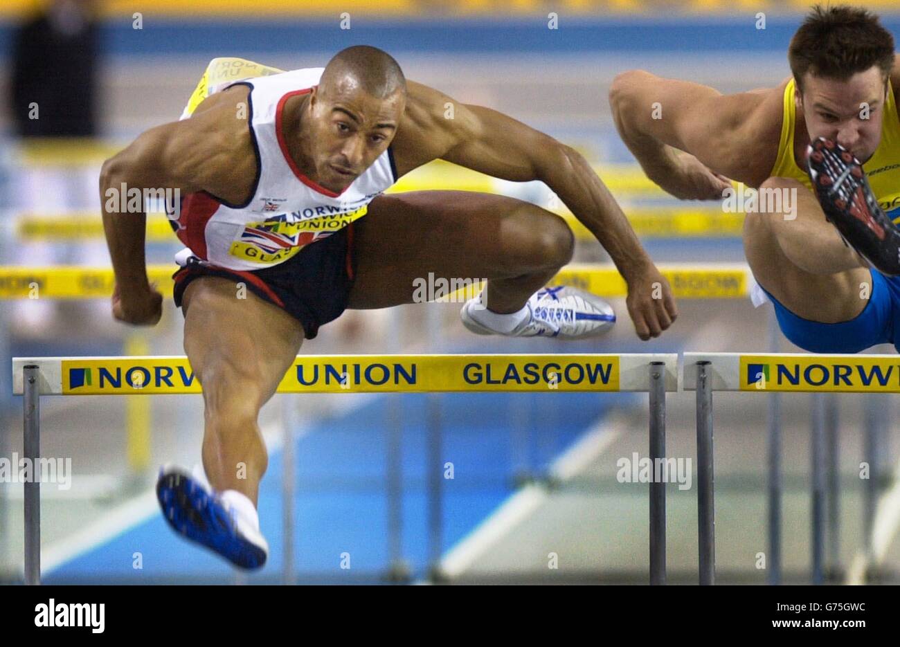 Britain's Colin Jackson clears the last hurdle and leaves Sweden's ...