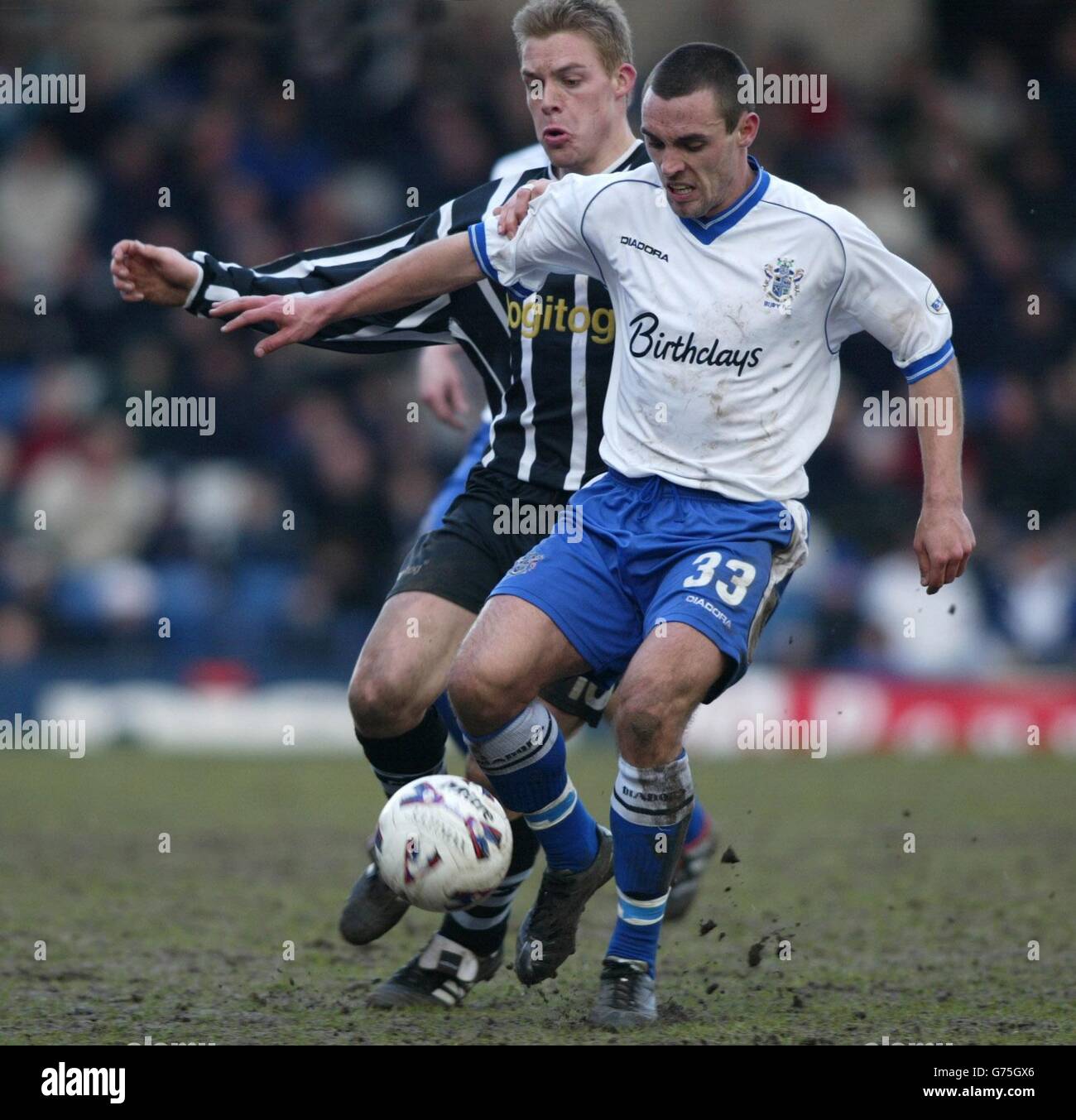 Notts County's Danny Allsopp (left) battles with Bury's Jamie Stuart ...