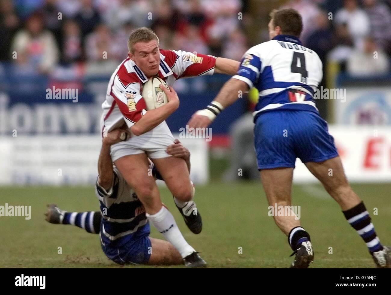 St Helens's Anthony Stewart (centre) is caught by Halifax Blue Sox's ...