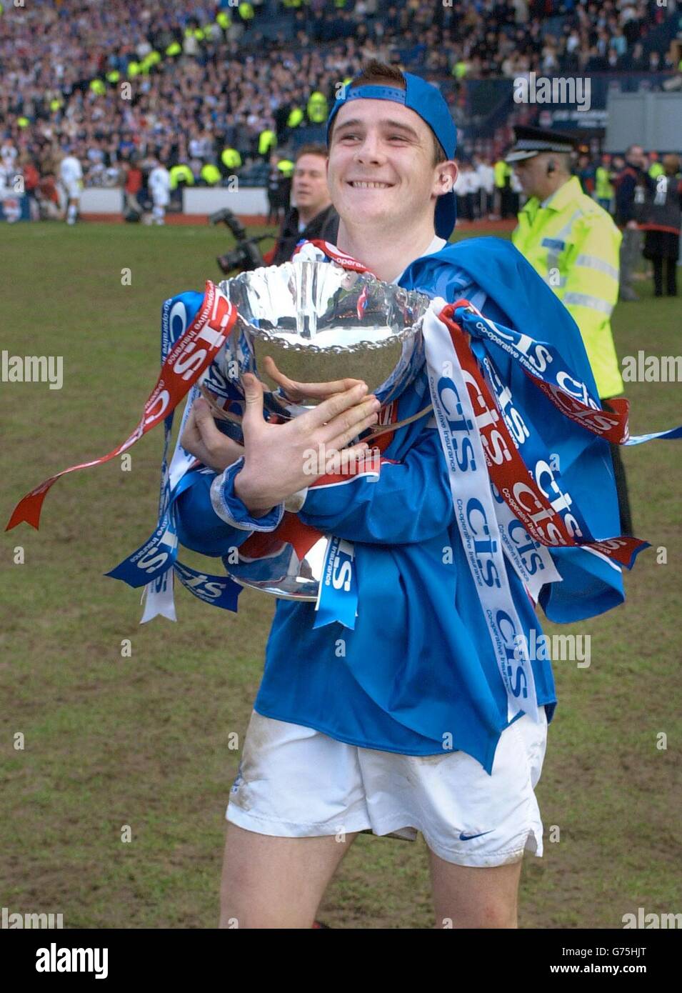 Rangers' captain Barry Ferguson holds the cup as the team celebrate ...