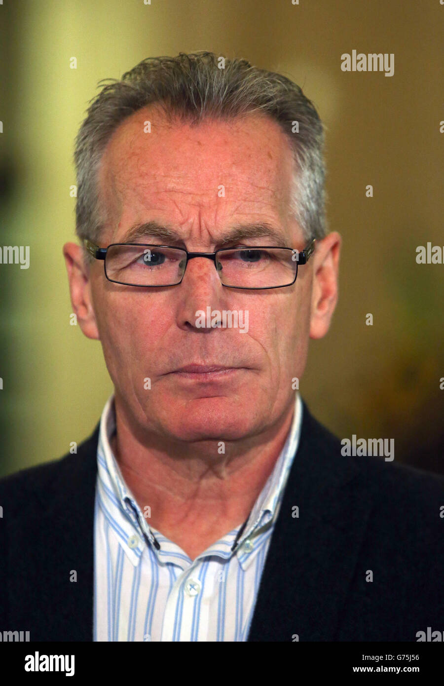 Gerry Kelly, of the Sinn Fein negotiation team, speaks to the media ...