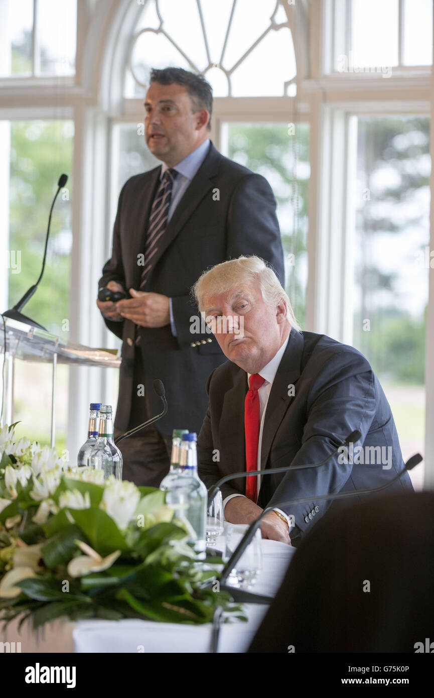 Donald Trump looks on as golf architect Martin Ebert outlines the ...