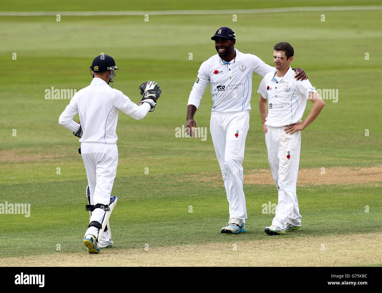 Derbyshire's David Wainwright (right) celebrates after taking the ...