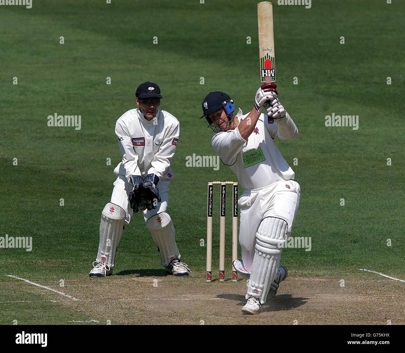 Somerset batsman Peter Bowler drives a boundary as Yorkshire keeper ...