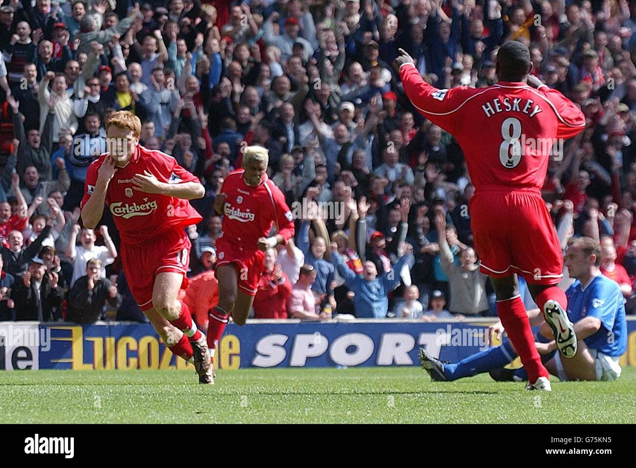 John Arne Riise (left) of Liverpool celebrates his first goal against ...
