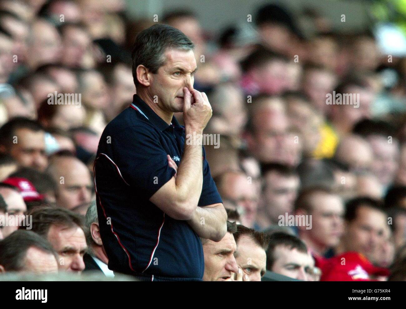Ipswich's manager George Burley looks on as his side go two goals down ...