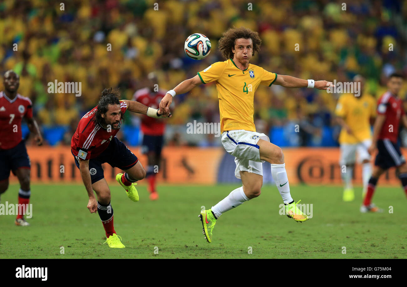 Colombia's Mario Yepes (left) and Brazil's David Luiz (right) battle ...