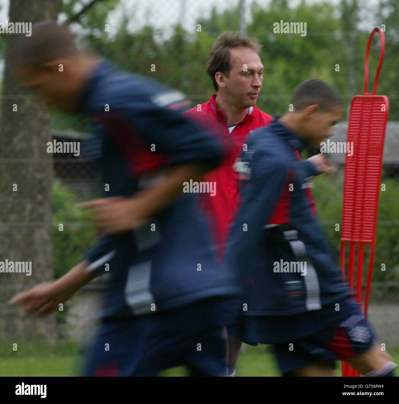 England coach David Platt works his squad during an afternoon training ...