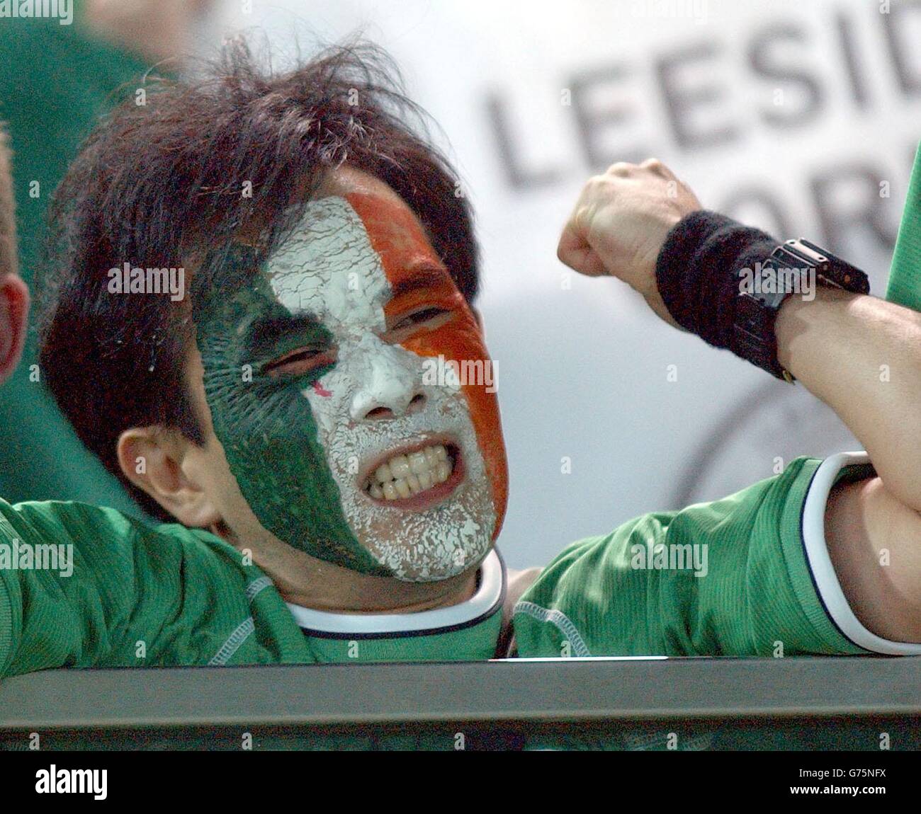 A Japanese Republic of Ireland Fan shows his delight after his side ...