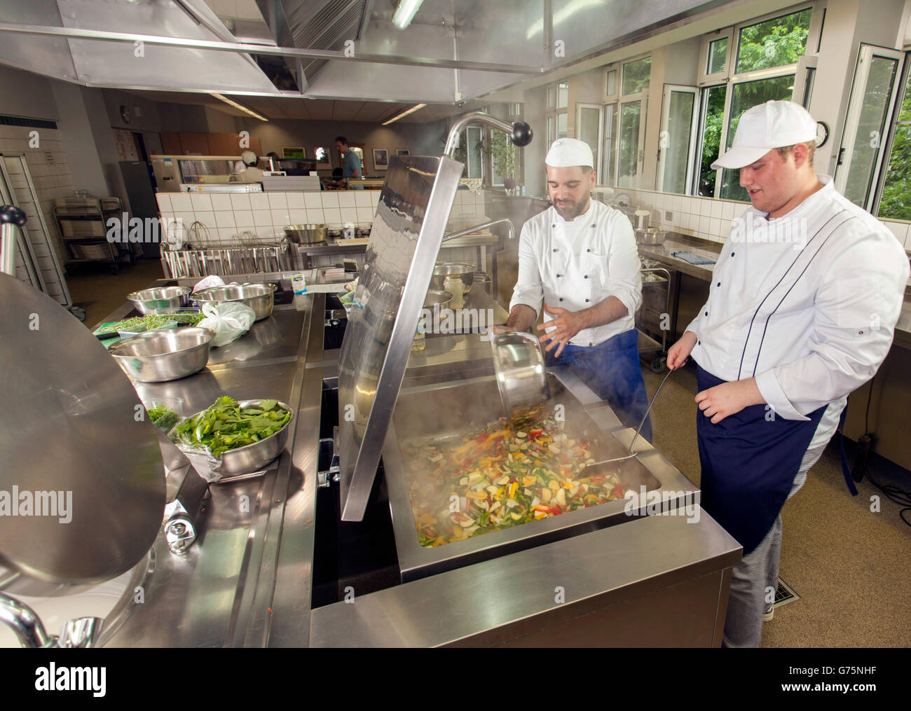 Preparation for lunch in a commercial kitchen Stock Photo - Alamy
