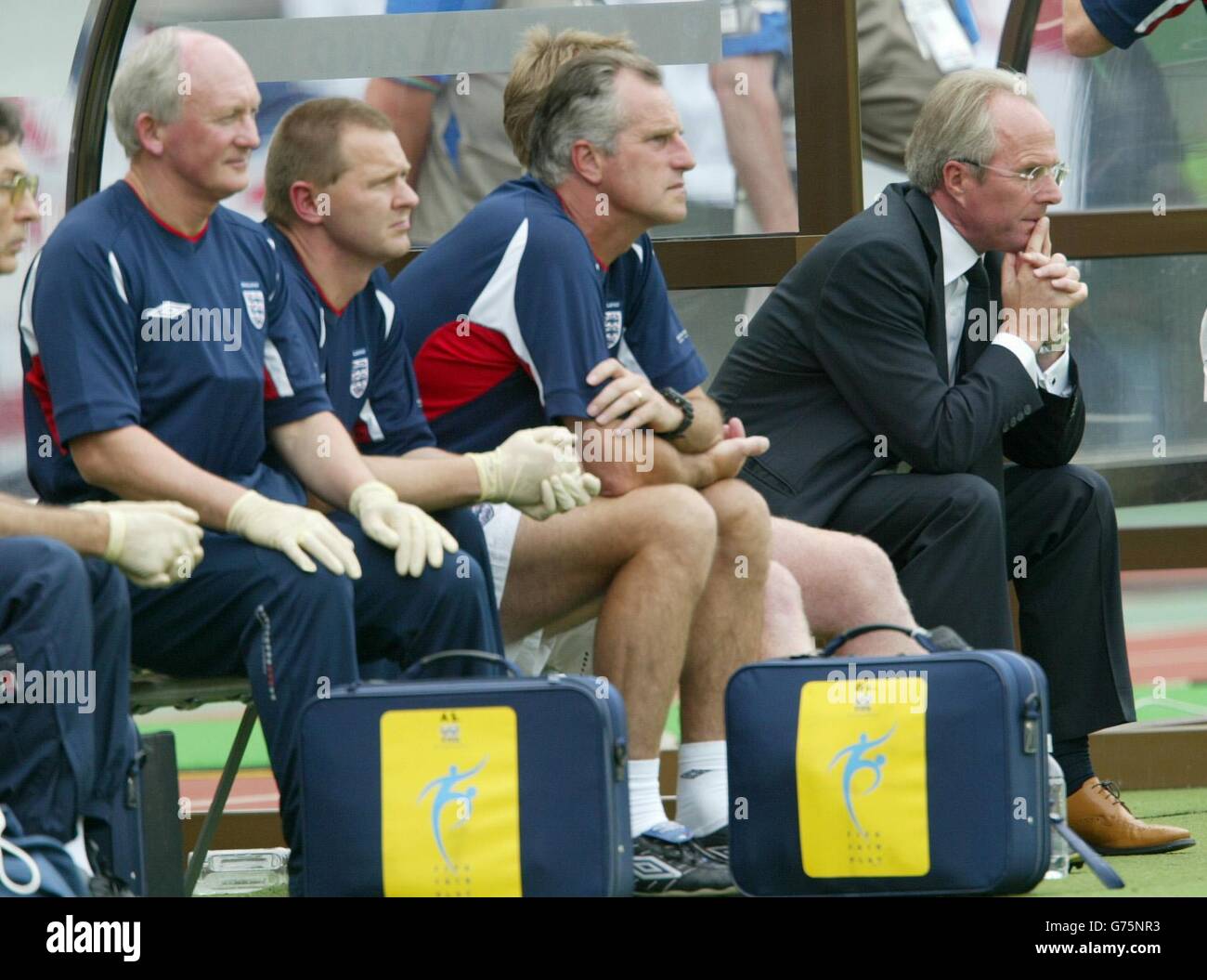 England coach Sven-Goran Eriksson (left) and his bench look on ...