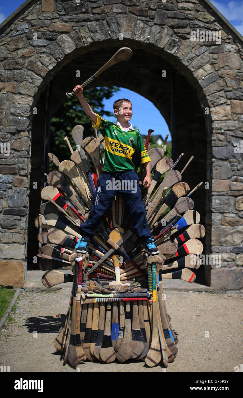 Luke Sugrue, aged 12, with a throne made from hurling sticks, donated ...