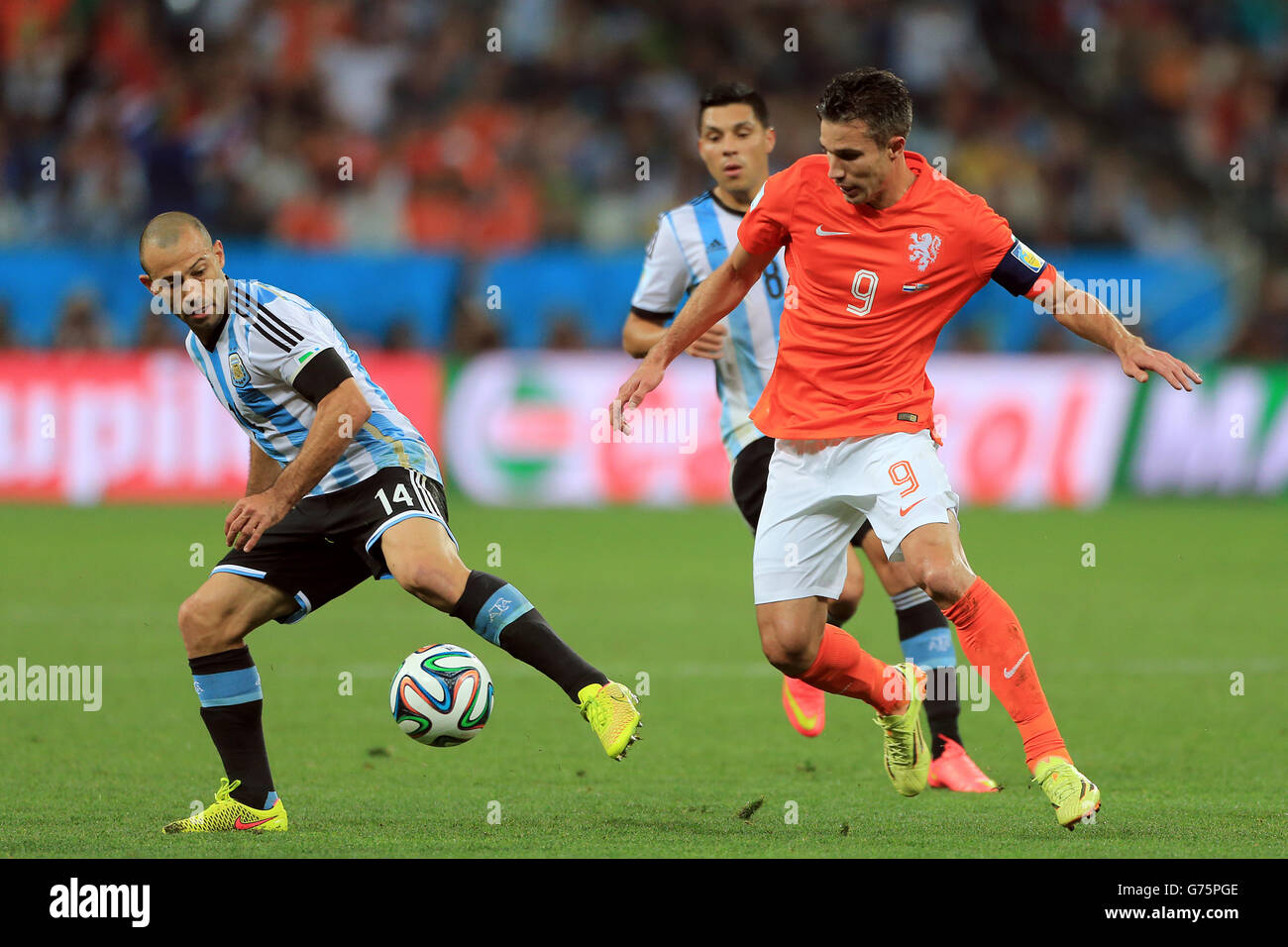 Argentina's Javier Mascherano battles for the ball with Netherlands ...