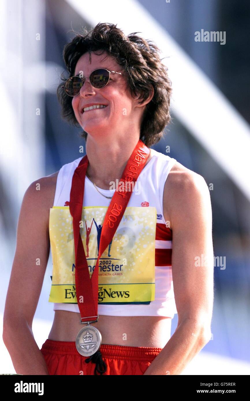 England's Lisa Kehler proudly smiles with her silver medal around her ...